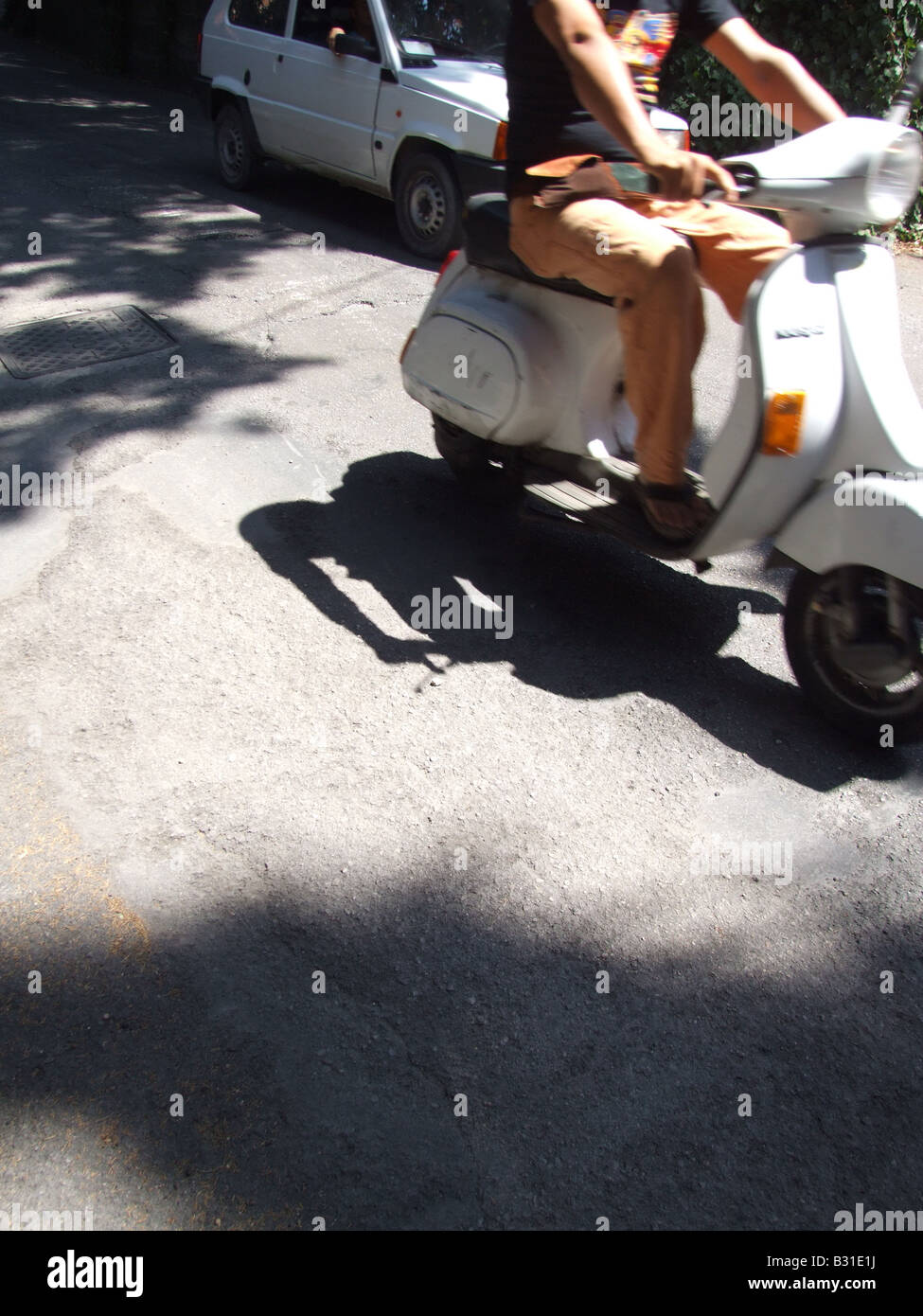 man riding vespa scooter in rome, italy Stock Photo - Alamy