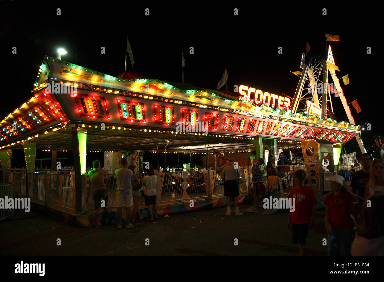 Bumper cars or scooters funfair ride at night Stock Photo - Alamy