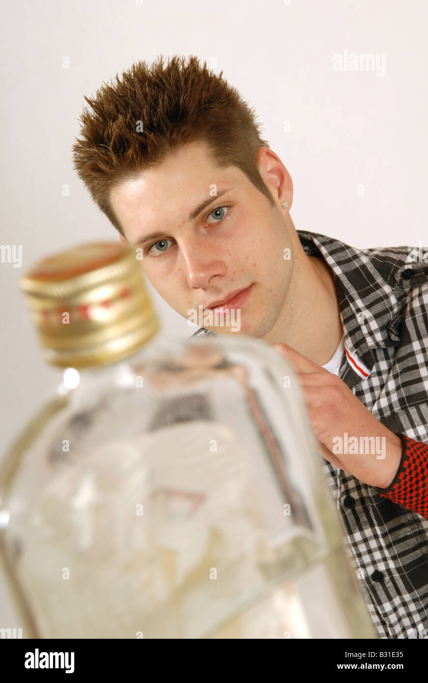 A young man with a drinking problem Stock Photo - Alamy