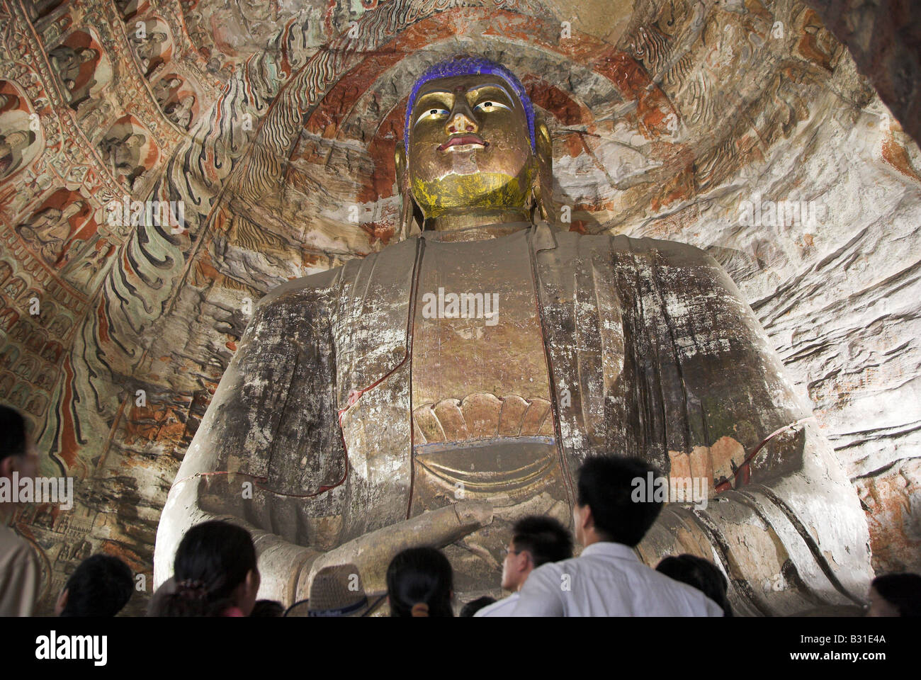 A 17 meter high statue at the Yungang Buddhist Caves, near Datong ...