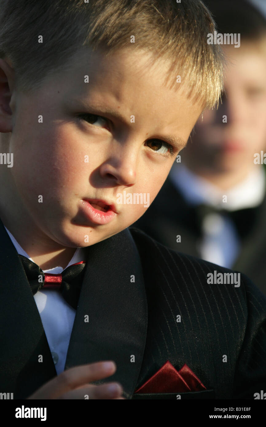 Young boy dressed in a dinner suit with a menacing expression Stock ...