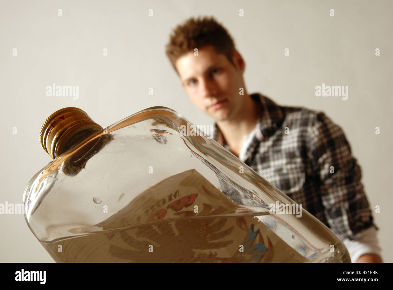 A young man with a drinking problem Stock Photo - Alamy