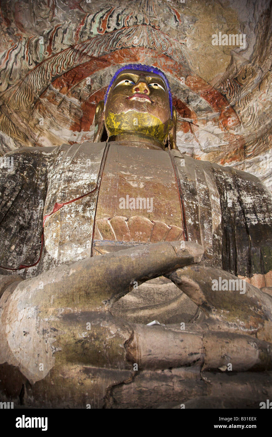 A 17 meter high statue at the Yungang Buddhist Caves, near Datong ...