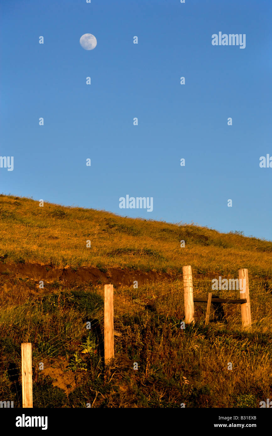 A full moon rises near the Big Sur coastline over the rolling Santa ...