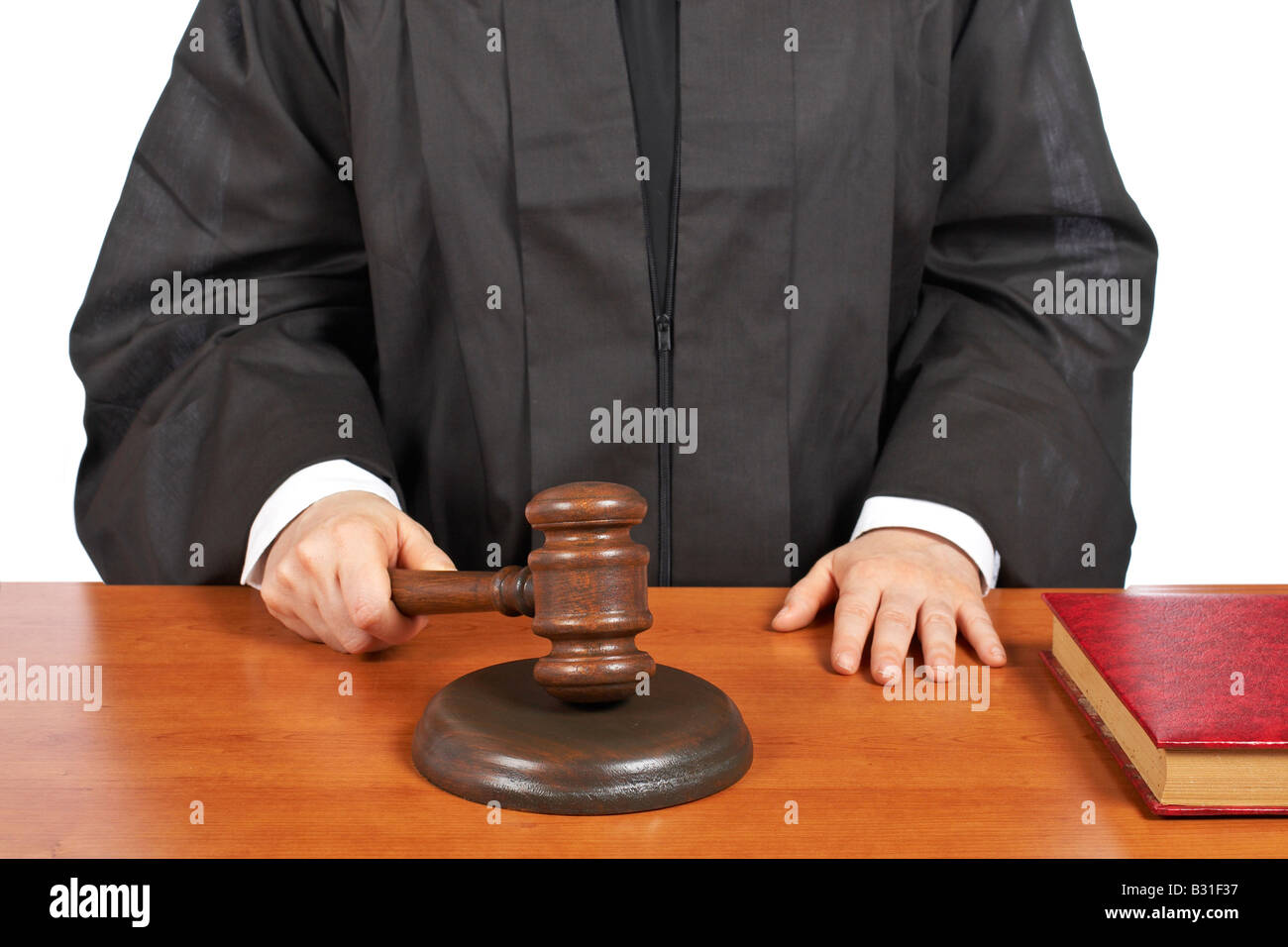 A female judge in a courtroom striking the gavel Shallow depth of field ...