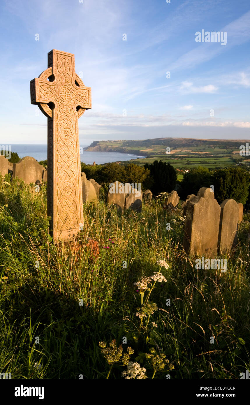 Cross in graveyard overlooking graveyard Stock Photo - Alamy
