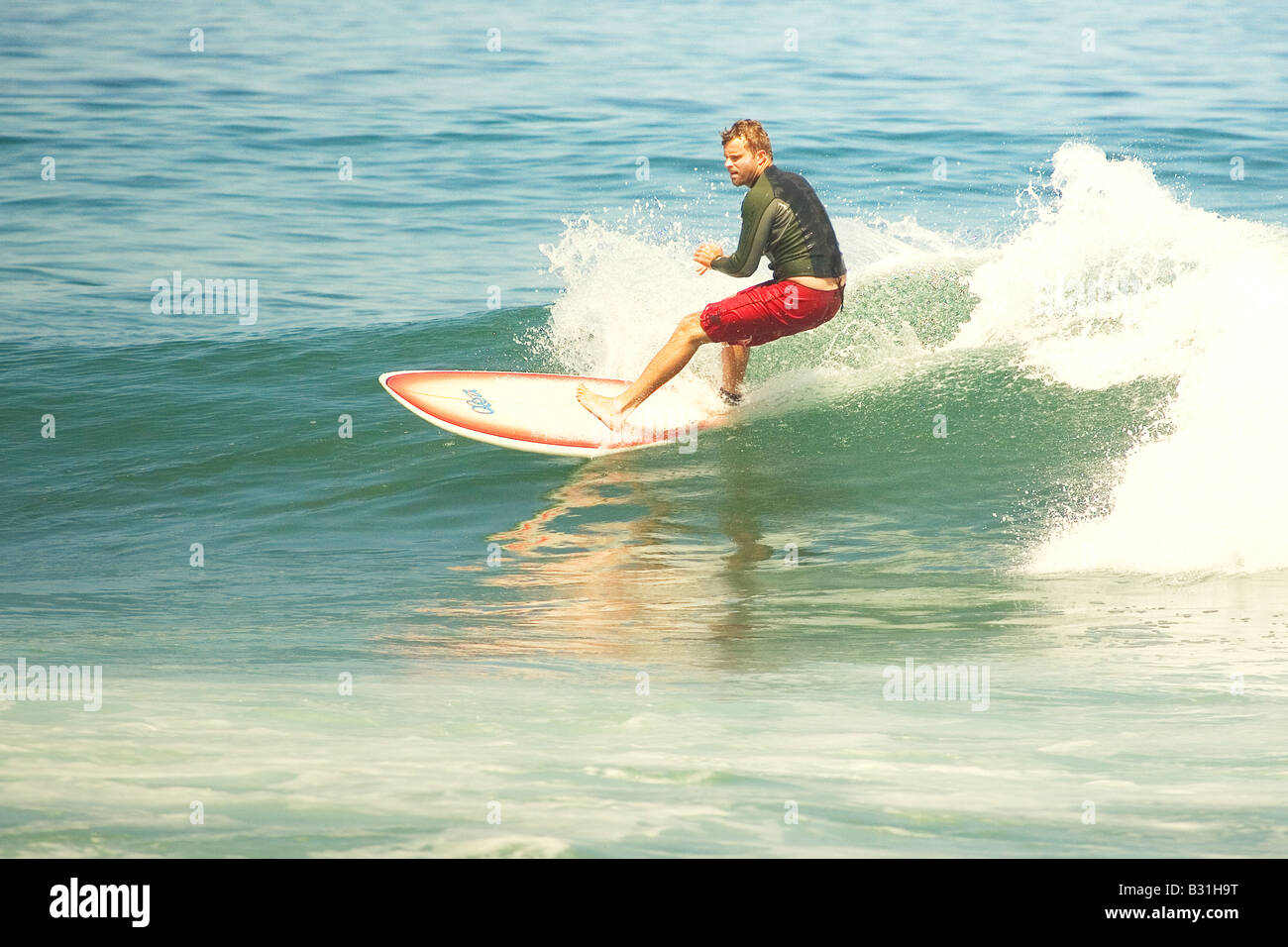 Man wet suit surfing wave hi-res stock photography and images - Alamy