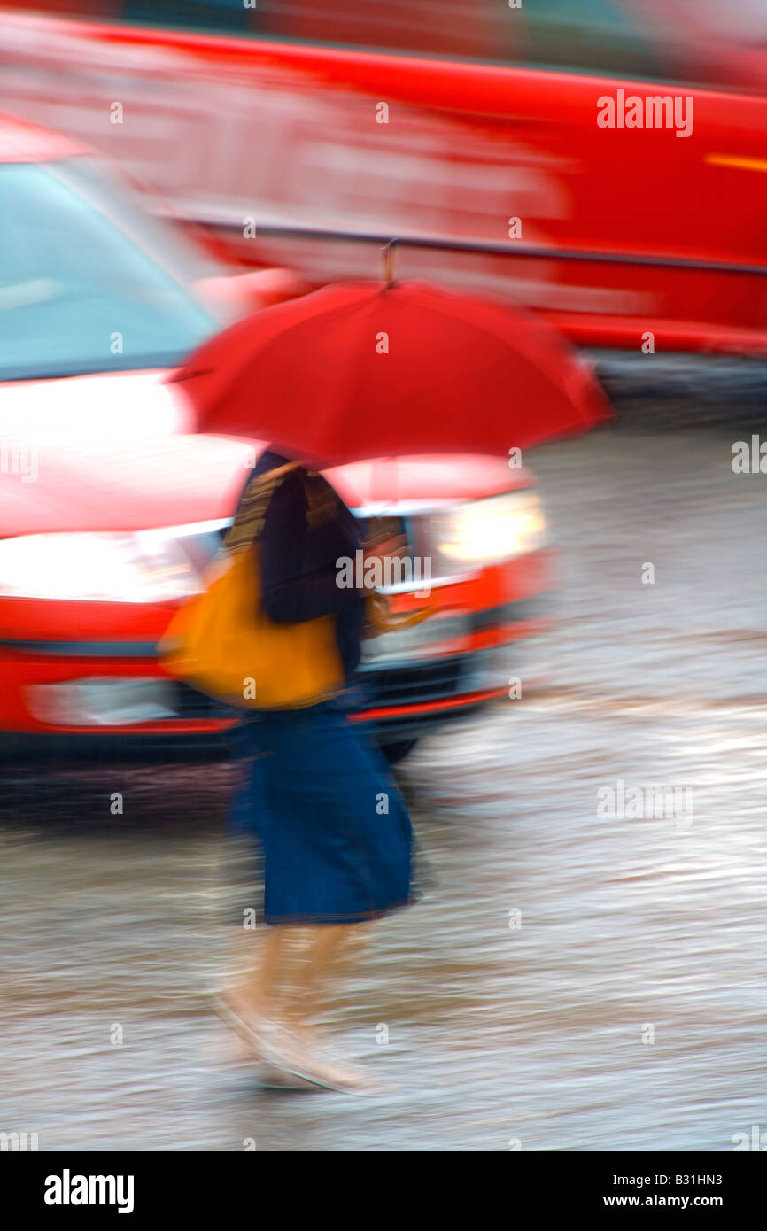 Pedestrian with red umbrella hi-res stock photography and images - Alamy