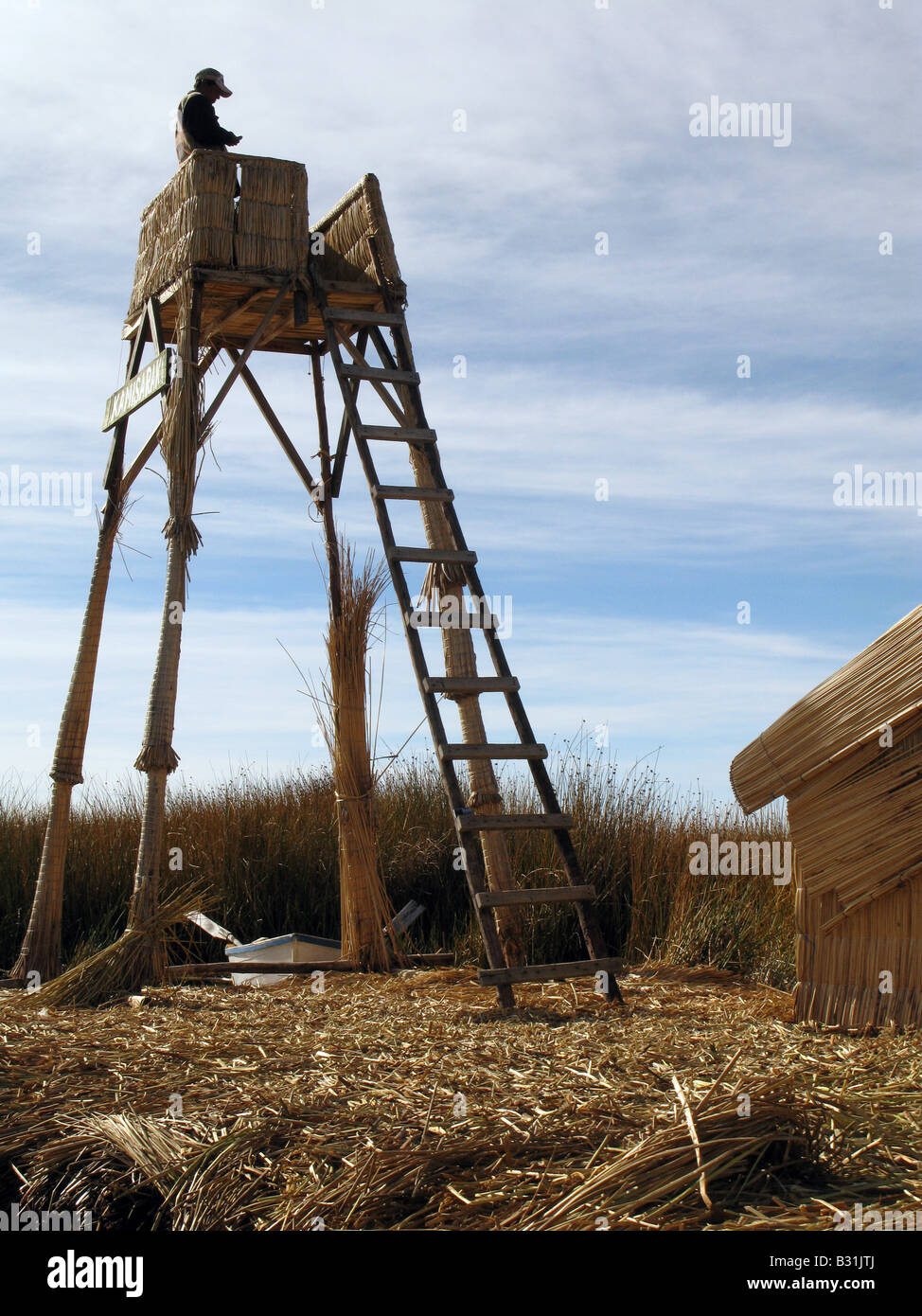 A Uros man on a reed lookout a pre-Incan people living on self ...