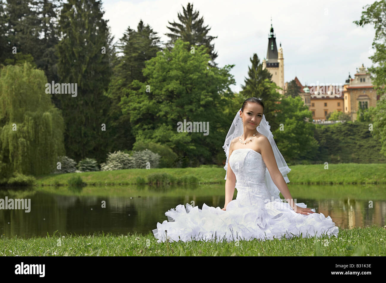 beautiful bride in white on the wedding in park Stock Photo - Alamy