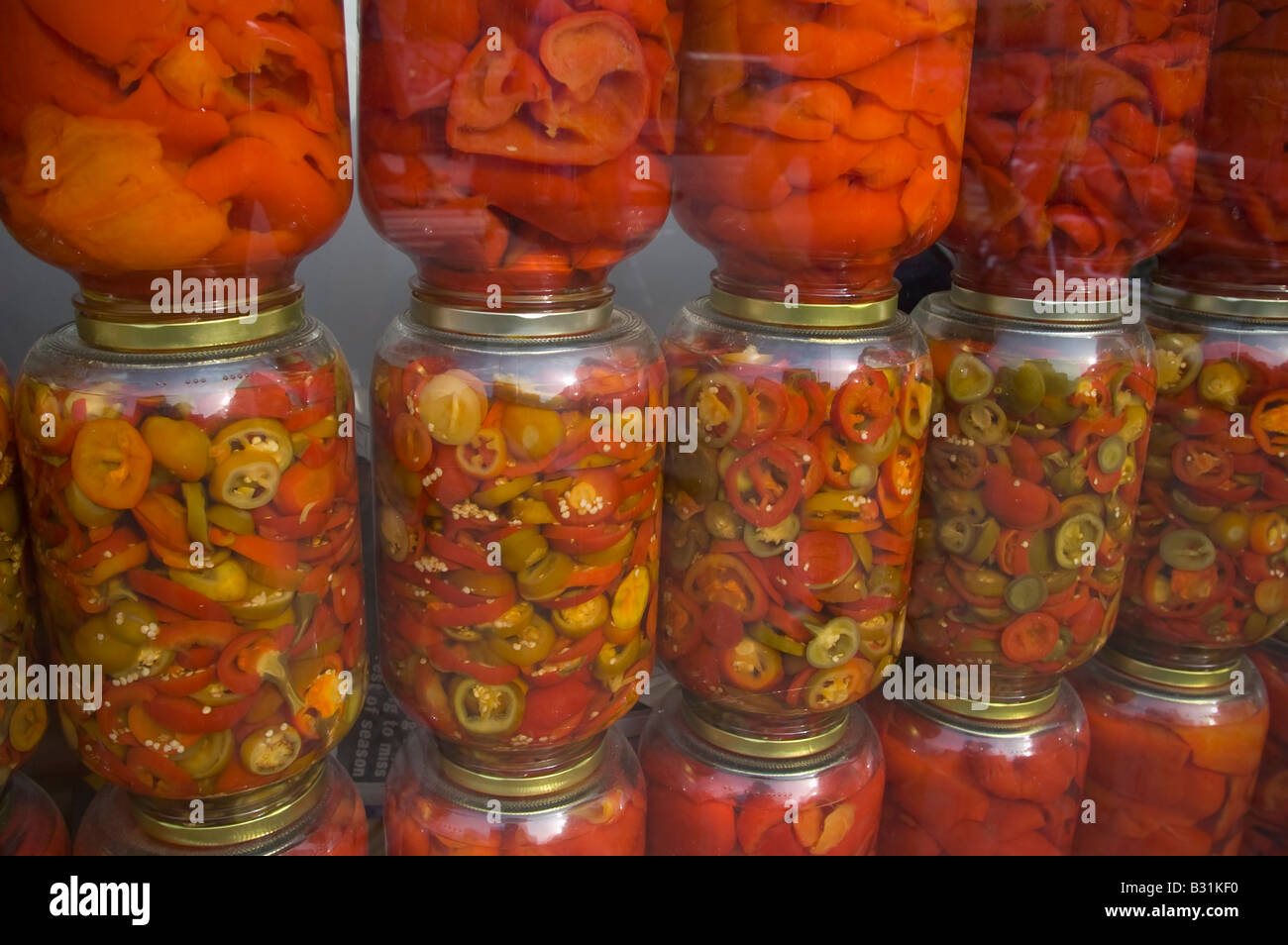 A display of pickled peppers in the window of a delicatessen in the ...