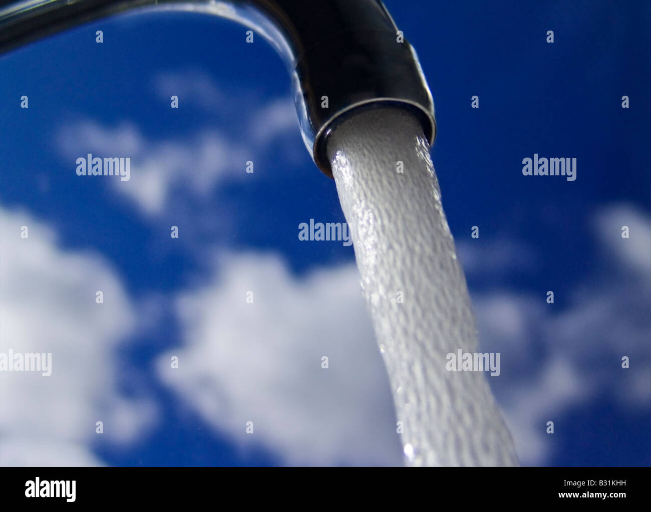 TAP RUNNING WATER BLUE SKY Dramatic low angle view of running water ...