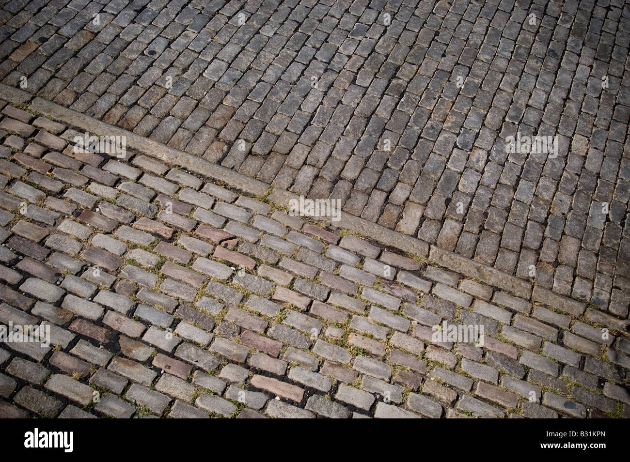 A detail of a street in Lower Manhattan in New York paved with Belgian ...