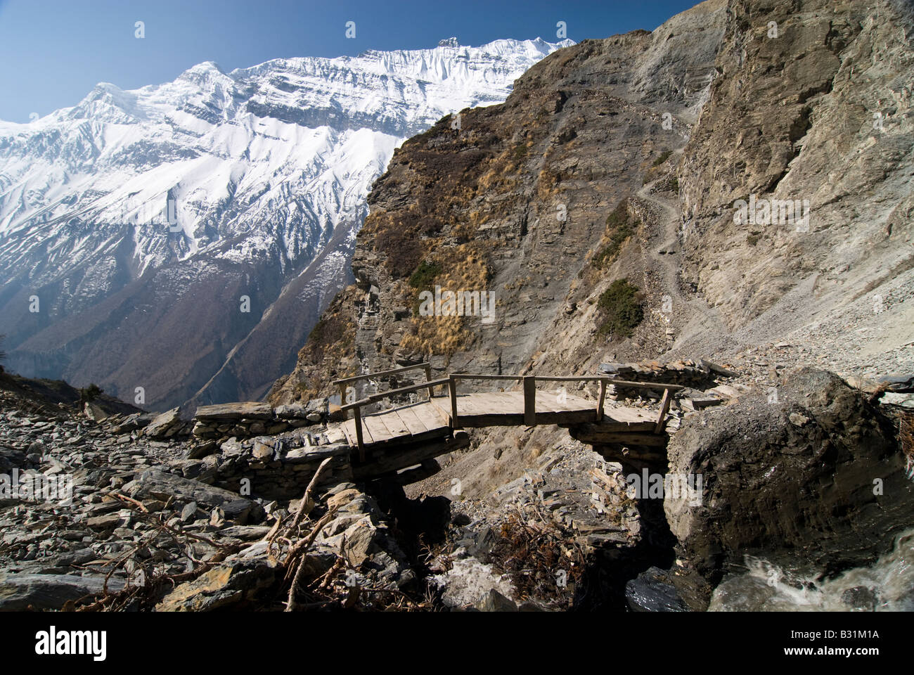 Bridge and path in the Annapurna mountains, Nepal Stock Photo - Alamy