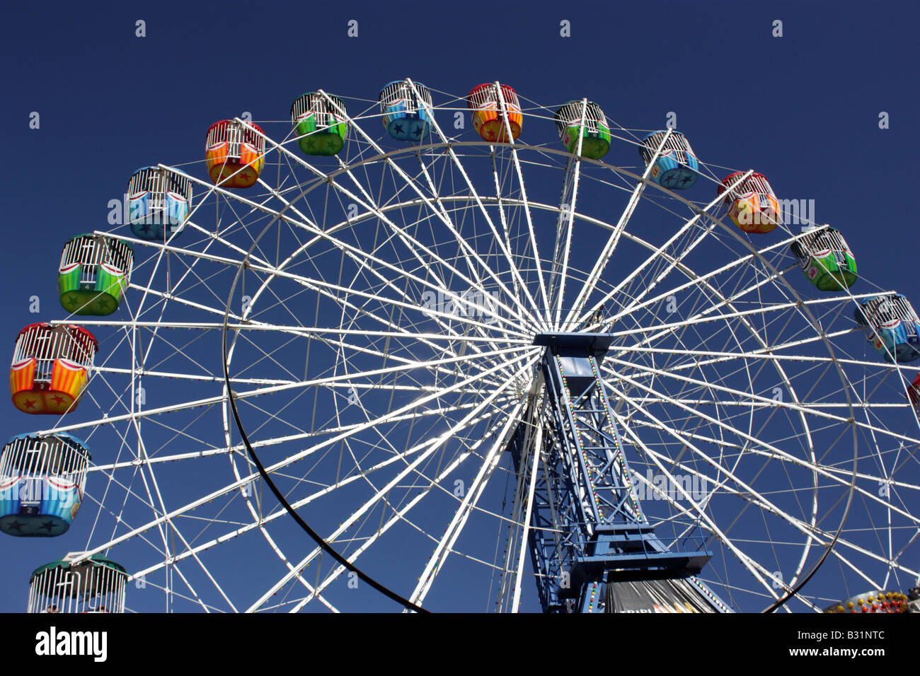 FERRIS WHEEL AT FAIRGROUND AGAINST BRIGHT BLUE SKY HORIZONTAL BDA11265 ...