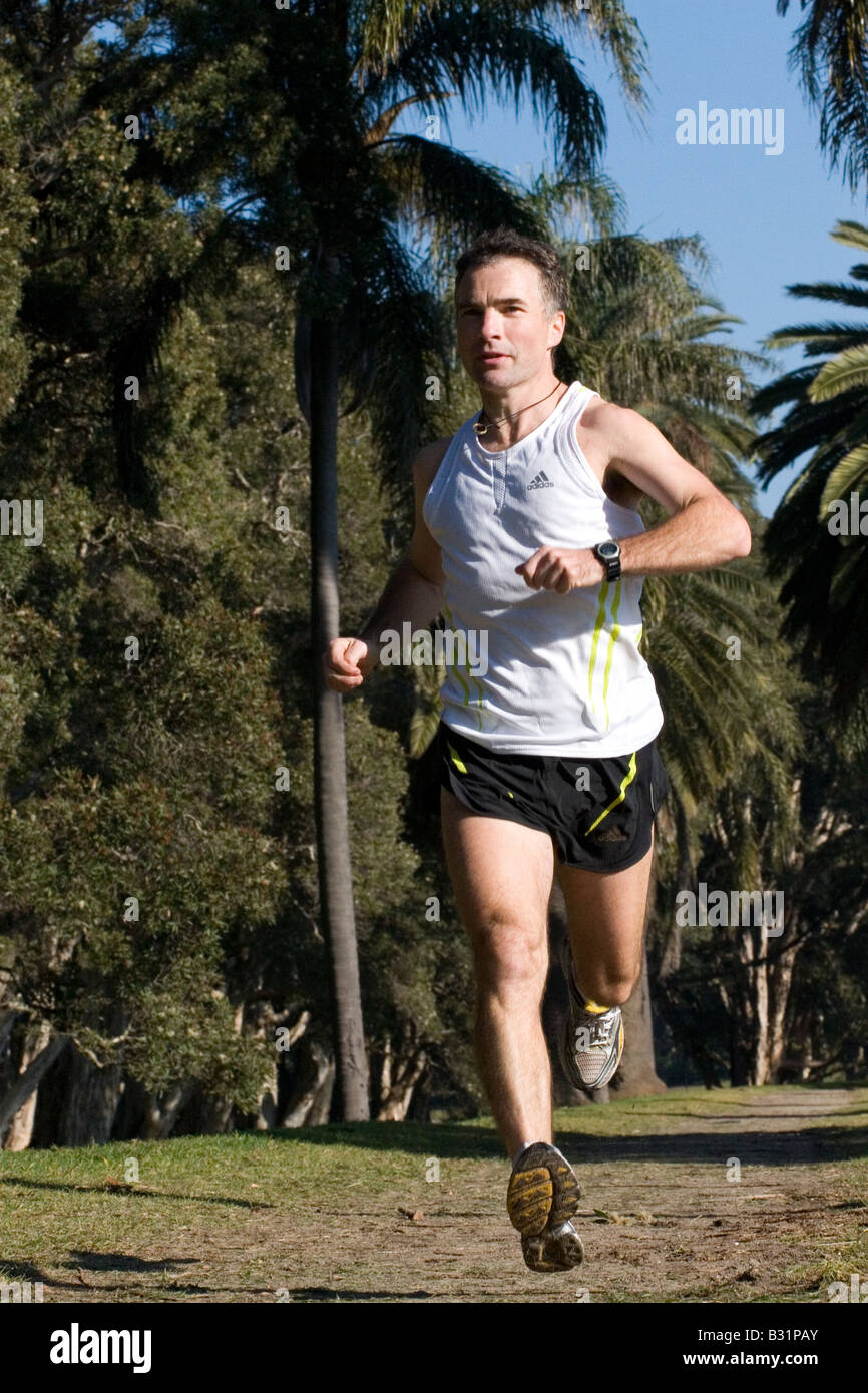 Male Runner in Park Stock Photo - Alamy