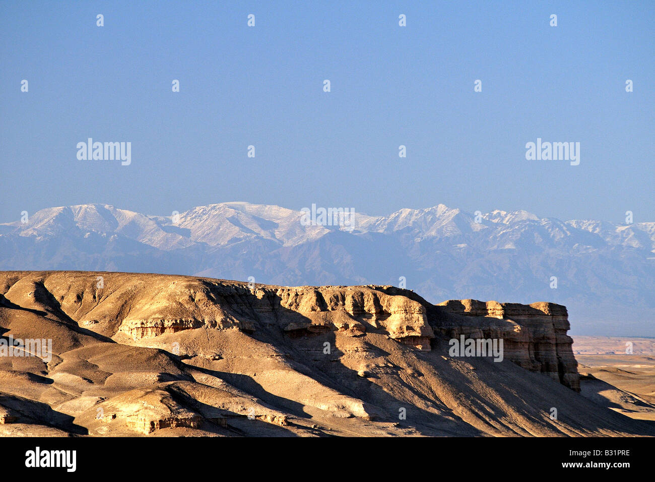 desert and snow capped mountains seen together in west China Stock ...