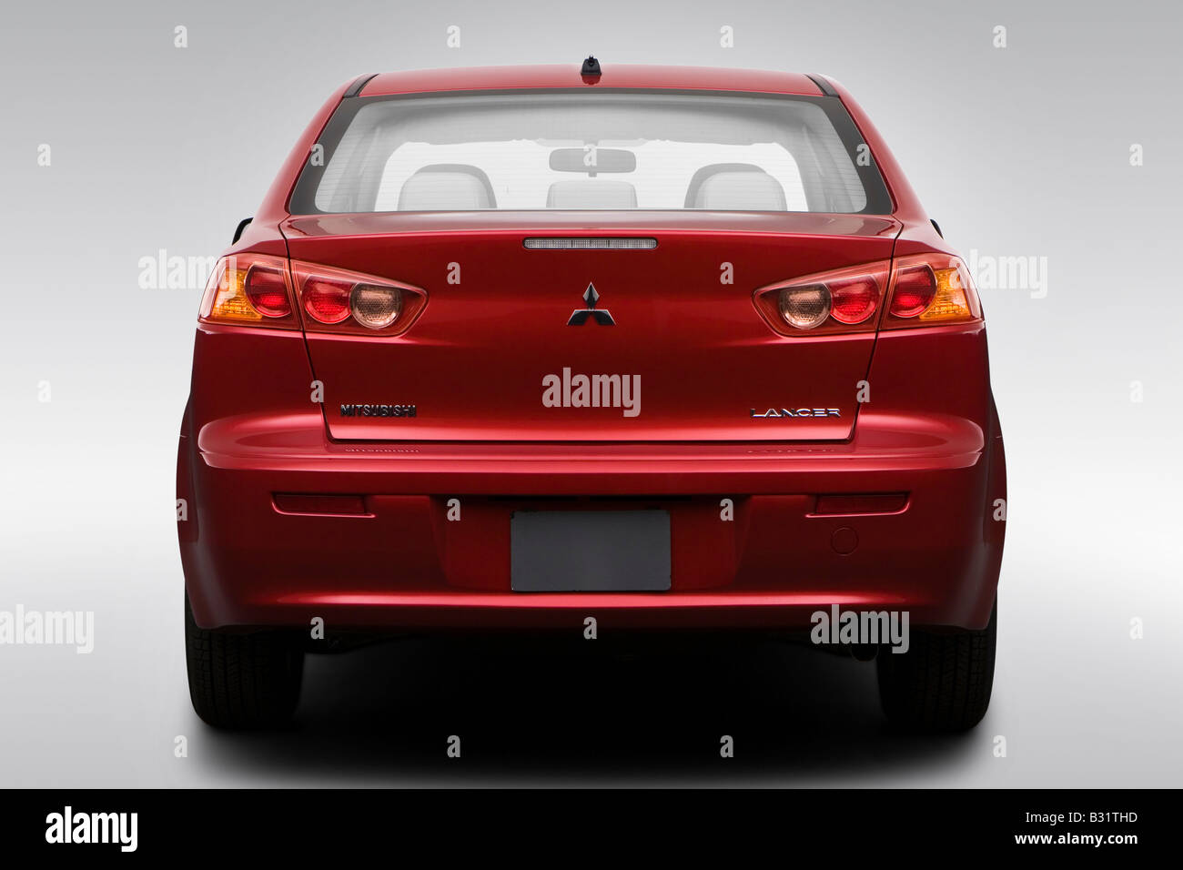2009 Mitsubishi Lancer ES in Red - Low/Wide Rear Stock Photo - Alamy