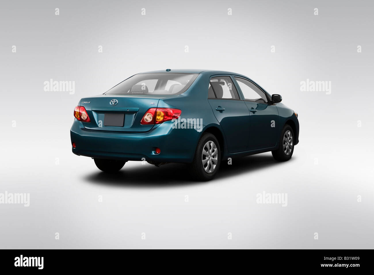 2009 Toyota Corolla LE in Green - Rear angle view Stock Photo - Alamy