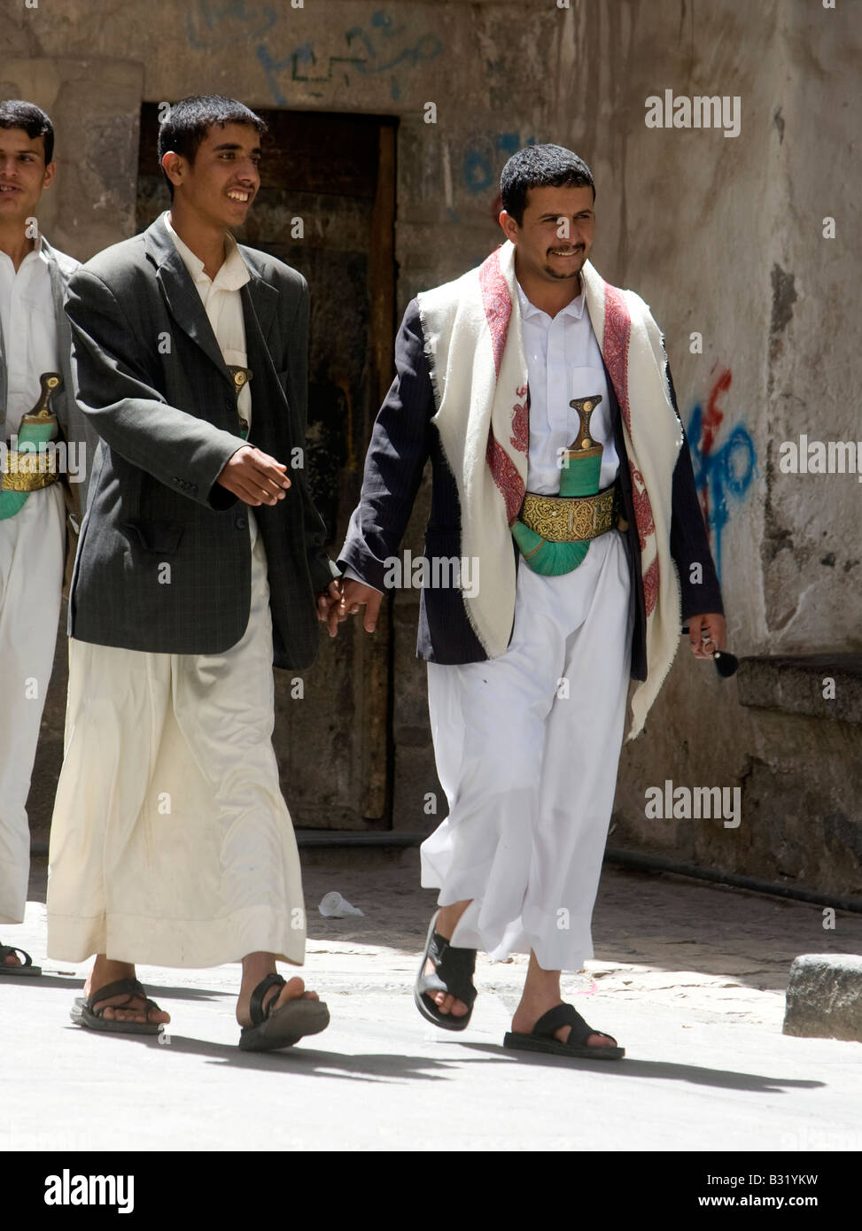Arab men holding hands hi-res stock photography and images - Alamy