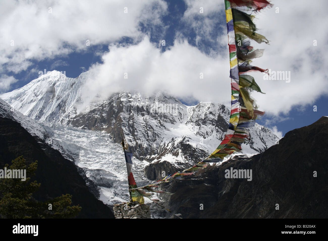 Prayer flags flapping in the wind in the mountains of Nepal Stock Photo ...
