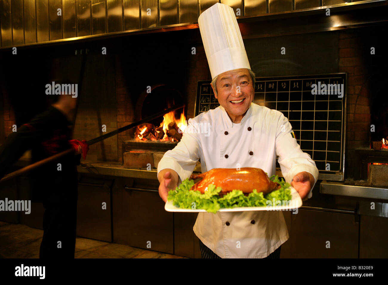 Chinese Cook Cooking Beijing Duck Stock Photo - Alamy