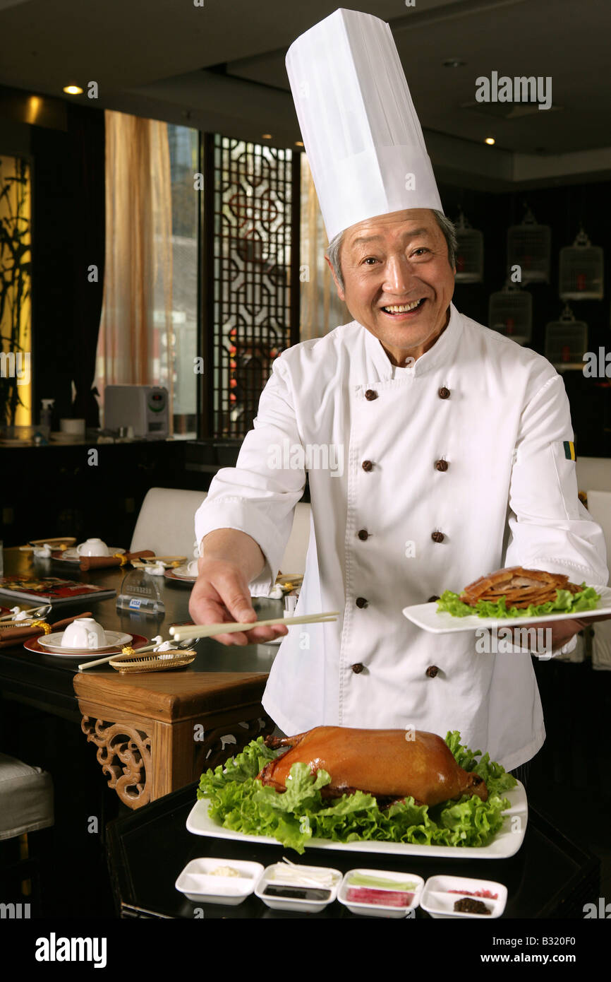 Chinese Cook Cooking Beijing Duck Stock Photo - Alamy