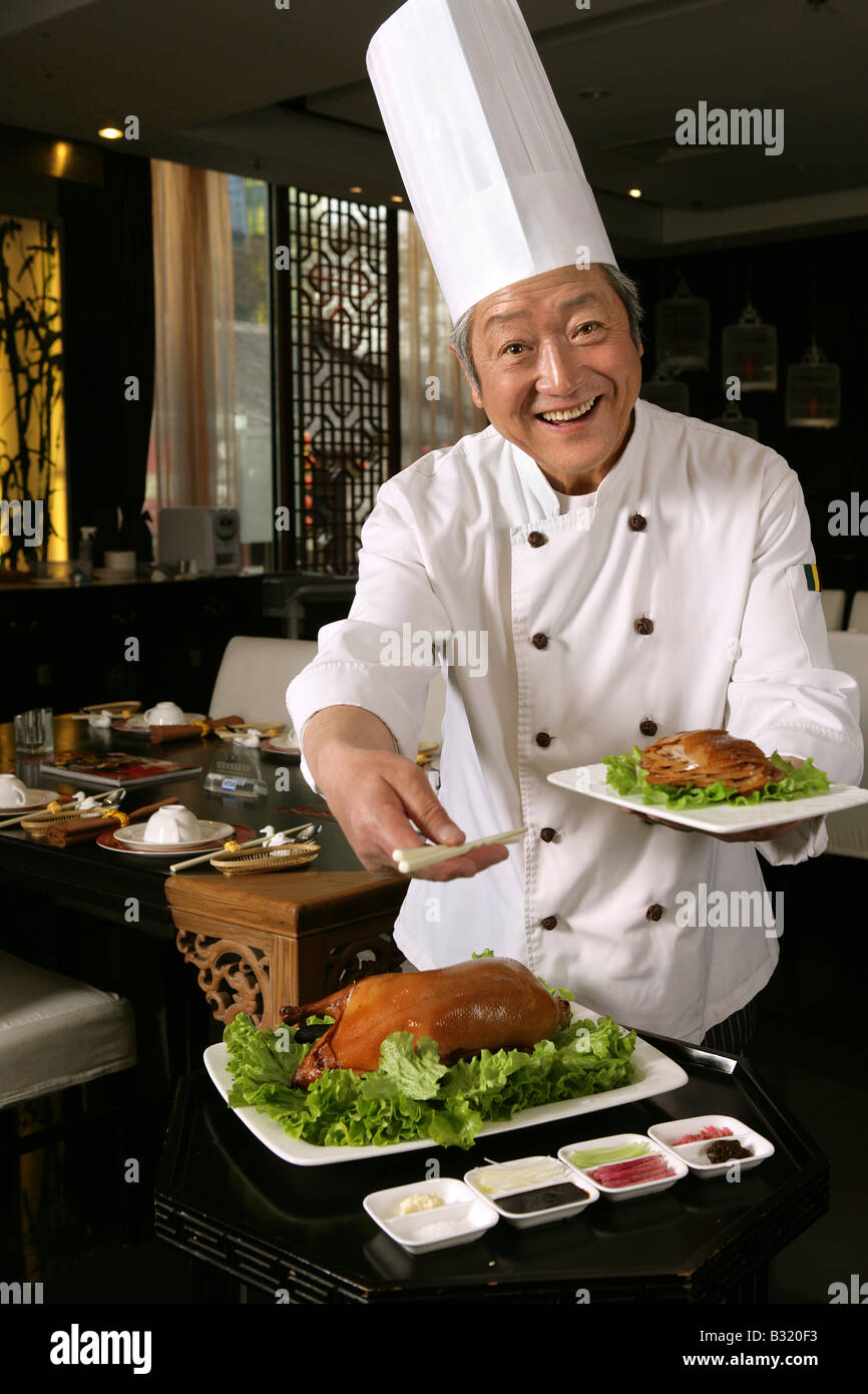 Chinese Cook Cooking Beijing Duck Stock Photo - Alamy