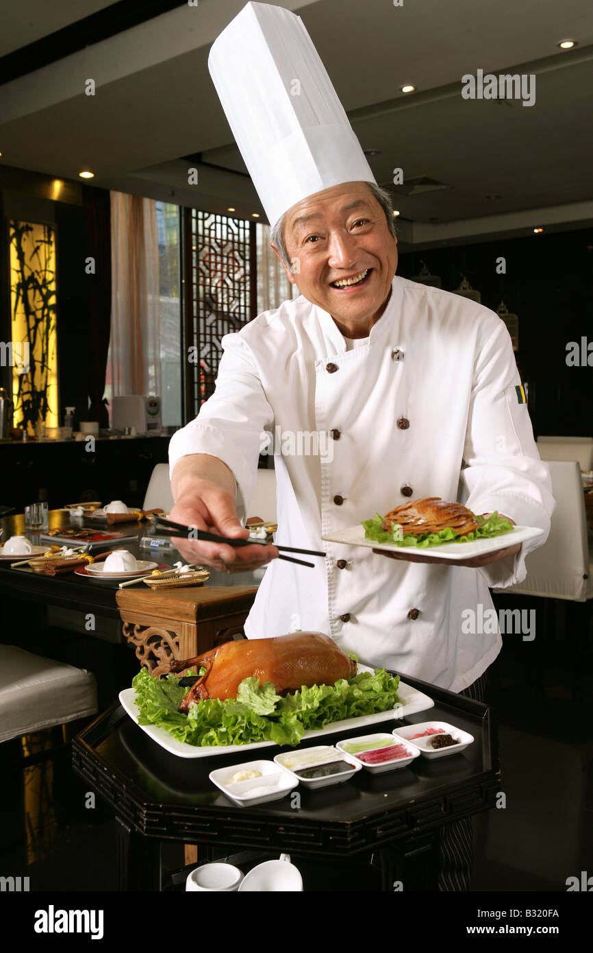 Chinese Cook Cooking Beijing Duck Stock Photo - Alamy