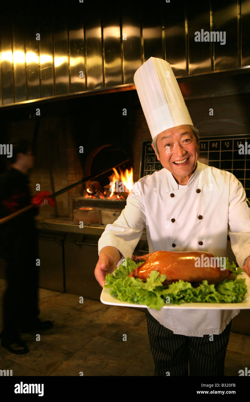 Chinese Cook Cooking Beijing Duck Stock Photo - Alamy