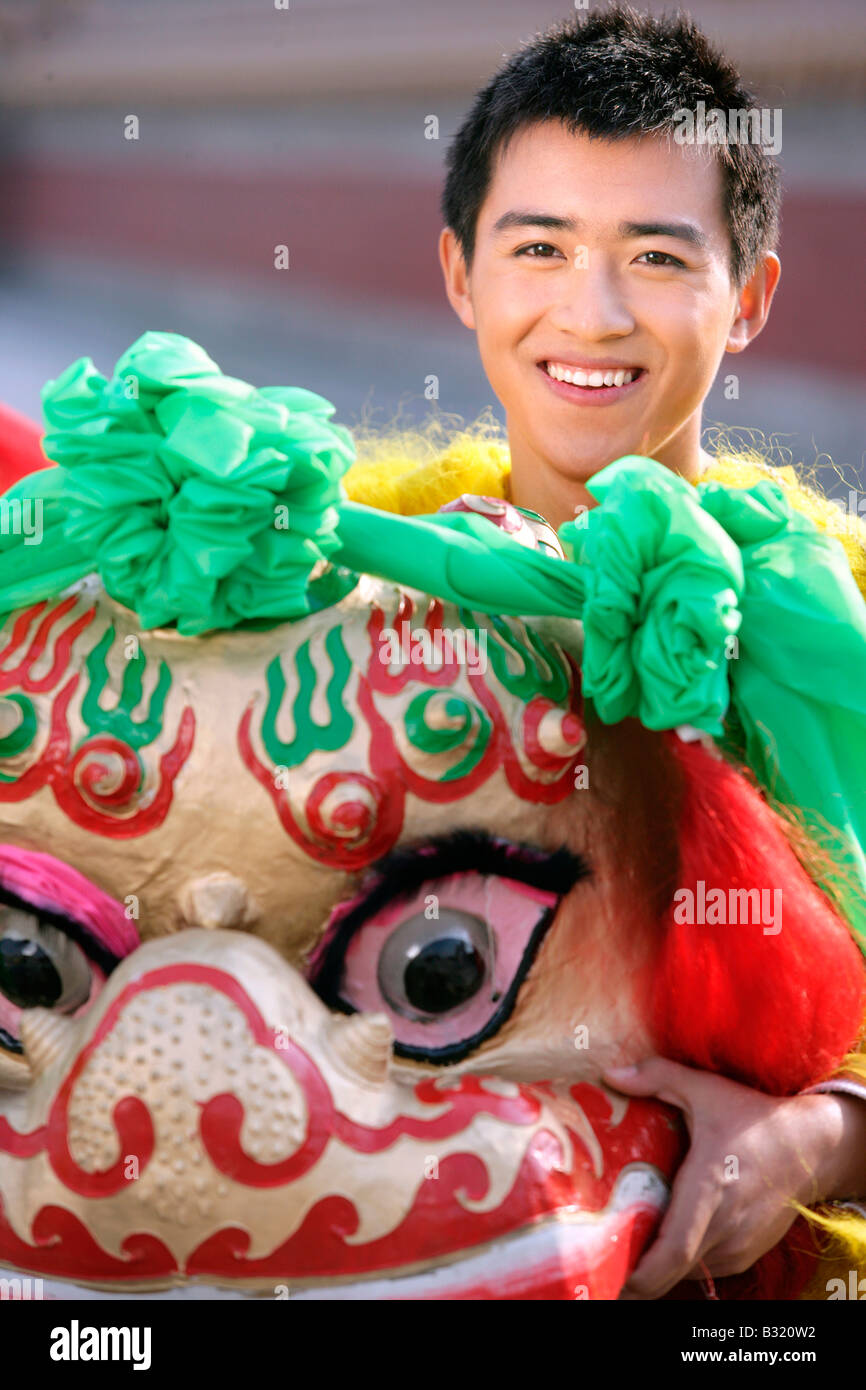 Chinese Young Man,Lion Dancing Stock Photo - Alamy