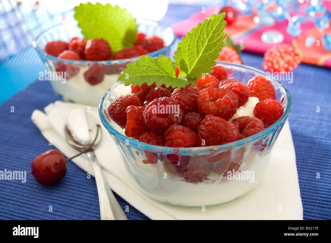 A cup of yoghurt with raspberries Stock Photo - Alamy