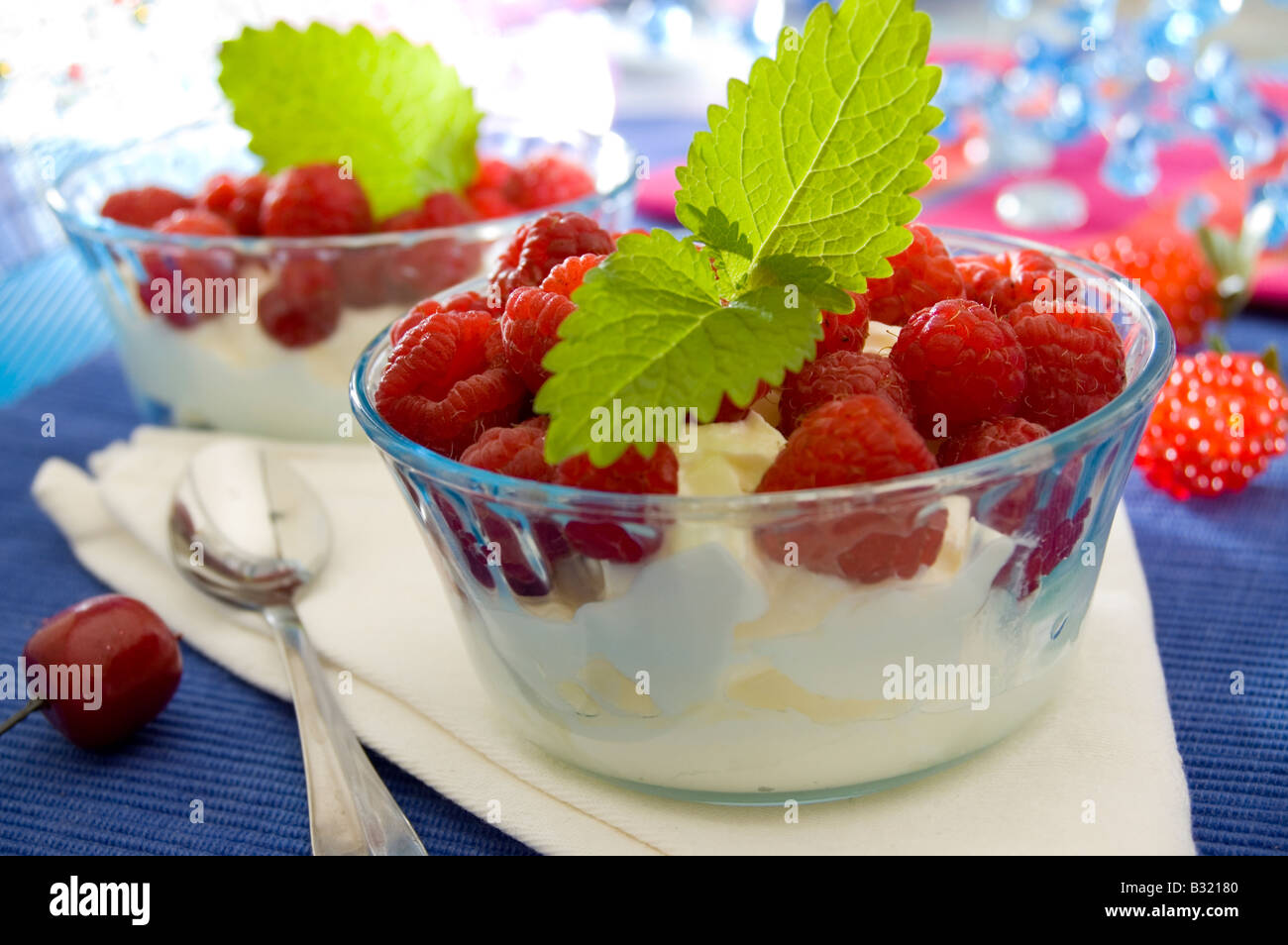 A cup of yoghurt with raspberries Stock Photo - Alamy