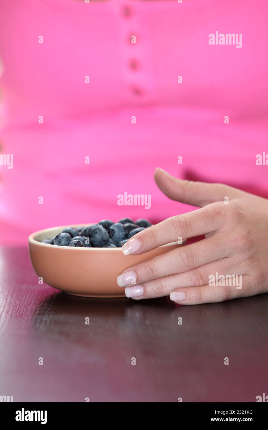 Young Woman with Bowl of Blueberries Model Released Stock Photo - Alamy