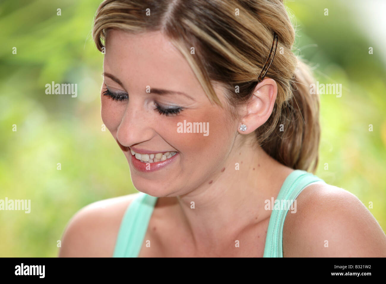 Demure Young Woman Laughing Model Released Stock Photo - Alamy