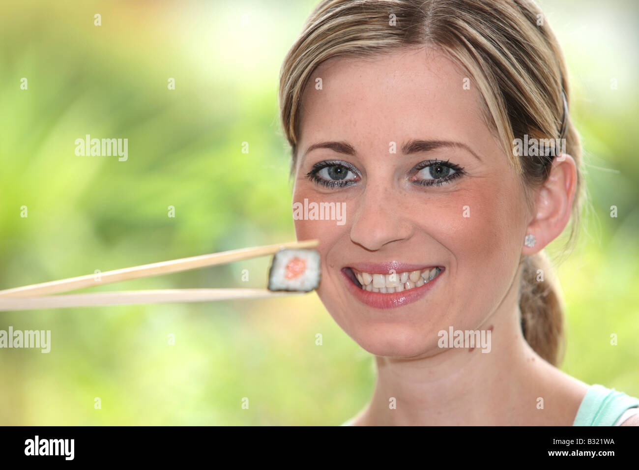 Young Woman Eating Sushi Model Released Stock Photo - Alamy
