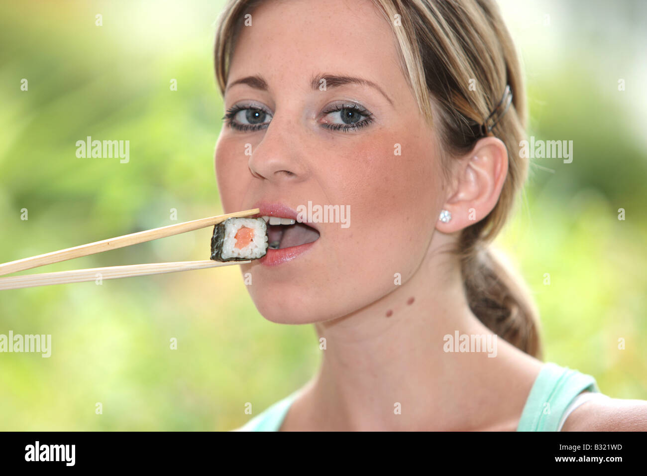 Young Woman Eating Sushi Model Released Stock Photo - Alamy