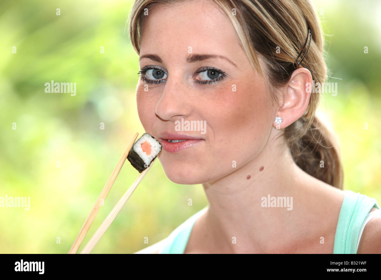 Young Woman Eating Sushi Model Released Stock Photo - Alamy