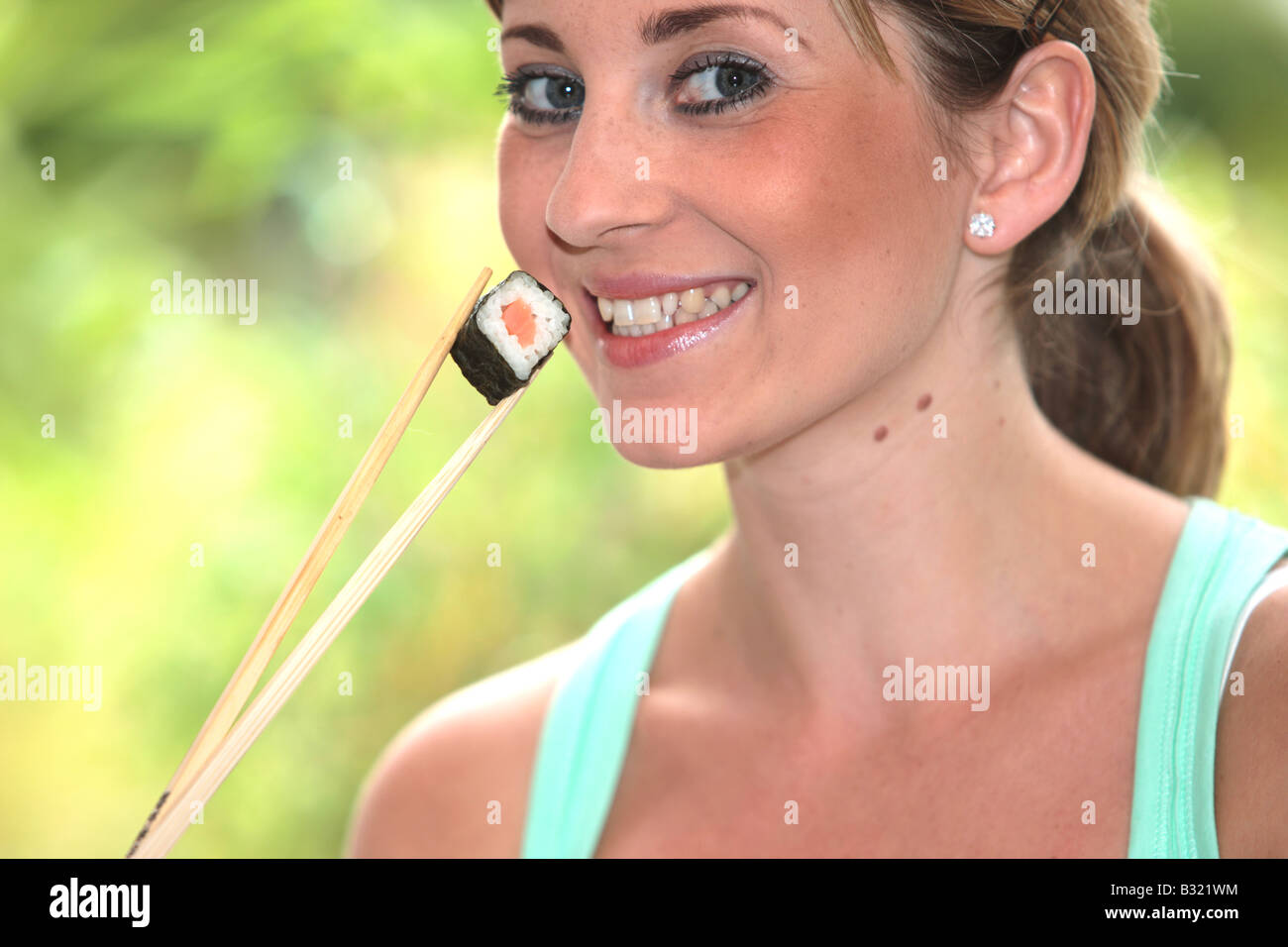 Young Woman Eating Sushi Model Released Stock Photo - Alamy
