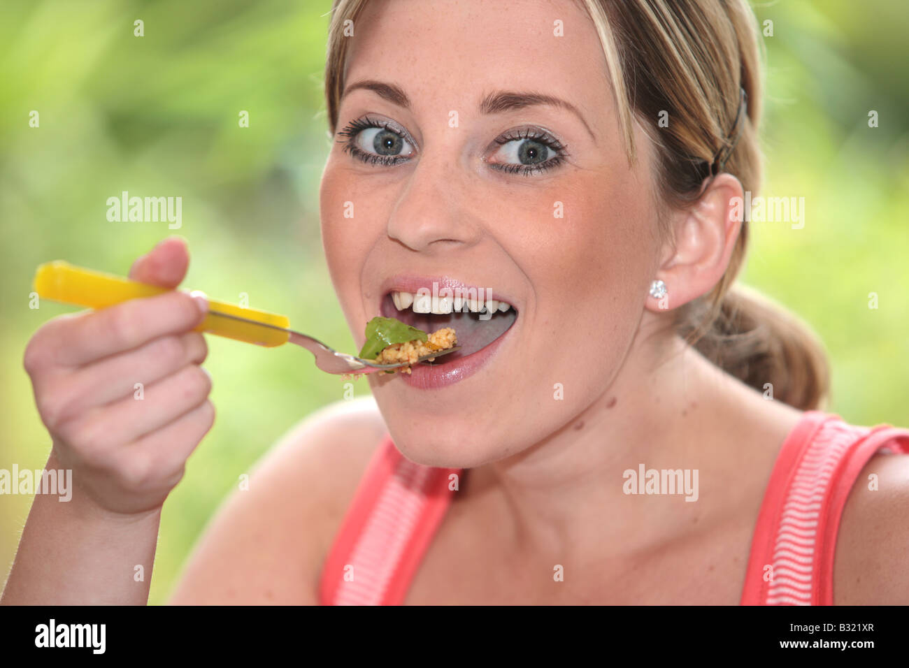 Young Woman Eating Couscous Salad Model Released Stock Photo - Alamy