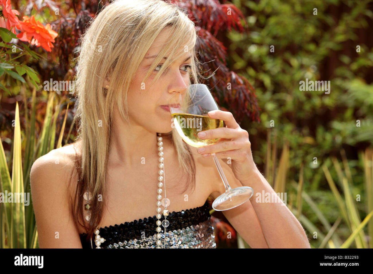 Young Woman Drinking White Wine Model Released Stock Photo - Alamy