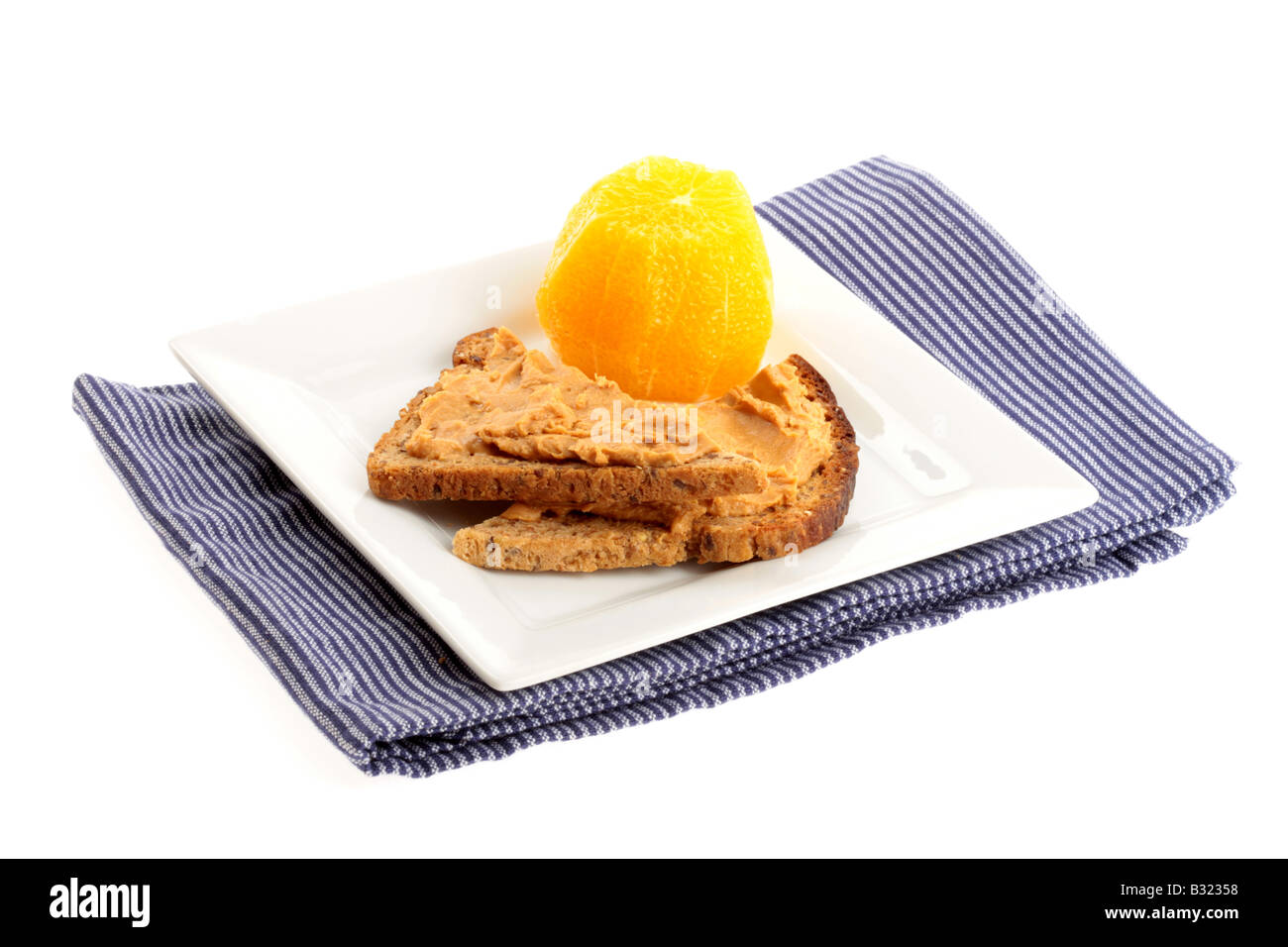 Rye Toast with Peanut Butter and an Orange Stock Photo - Alamy