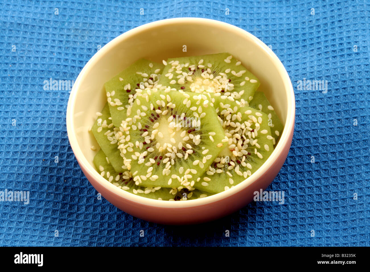 Kiwi with Sesame Seeds Stock Photo - Alamy