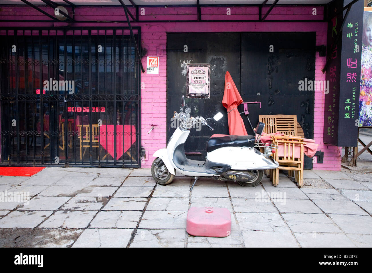 Chinese made scooter parked on a Beijing street Stock Photo - Alamy
