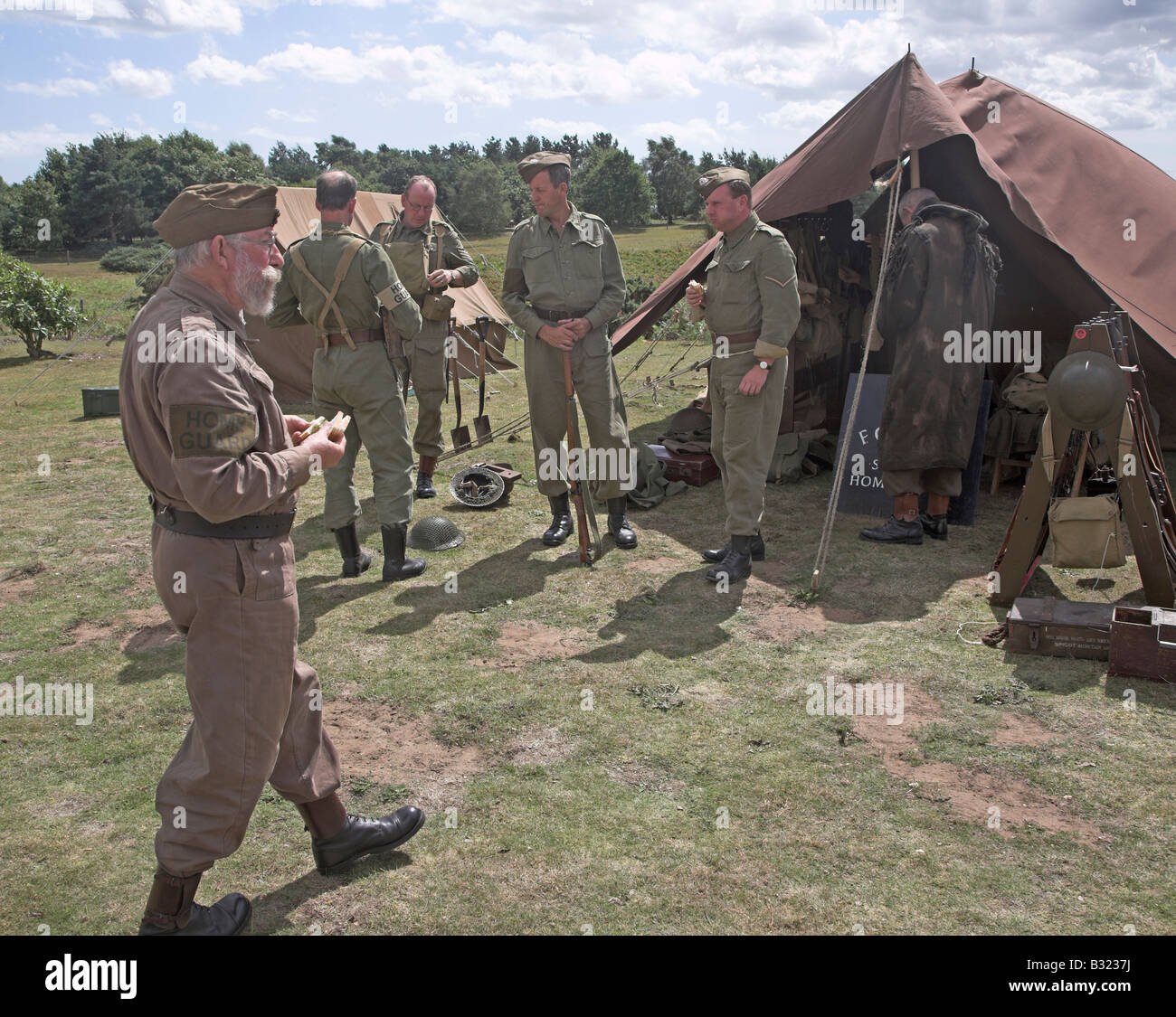 Home Guard soldiers by tents at their camp during 1940s world war two ...