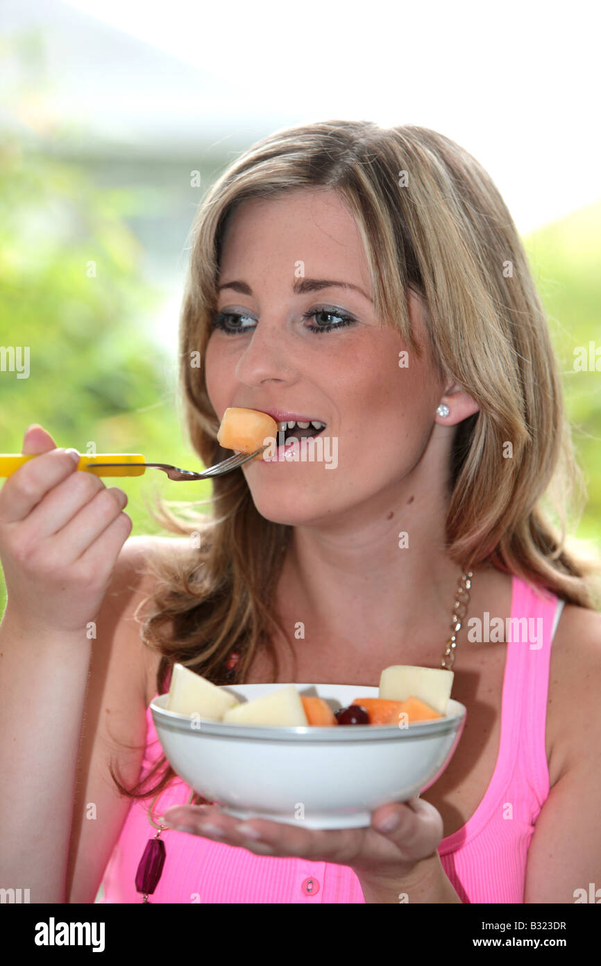 Young Woman Eating Fruit Salad Model Released Stock Photo - Alamy Young Woman Eating Fruit Salad Model Released Stock Photo - Alamy