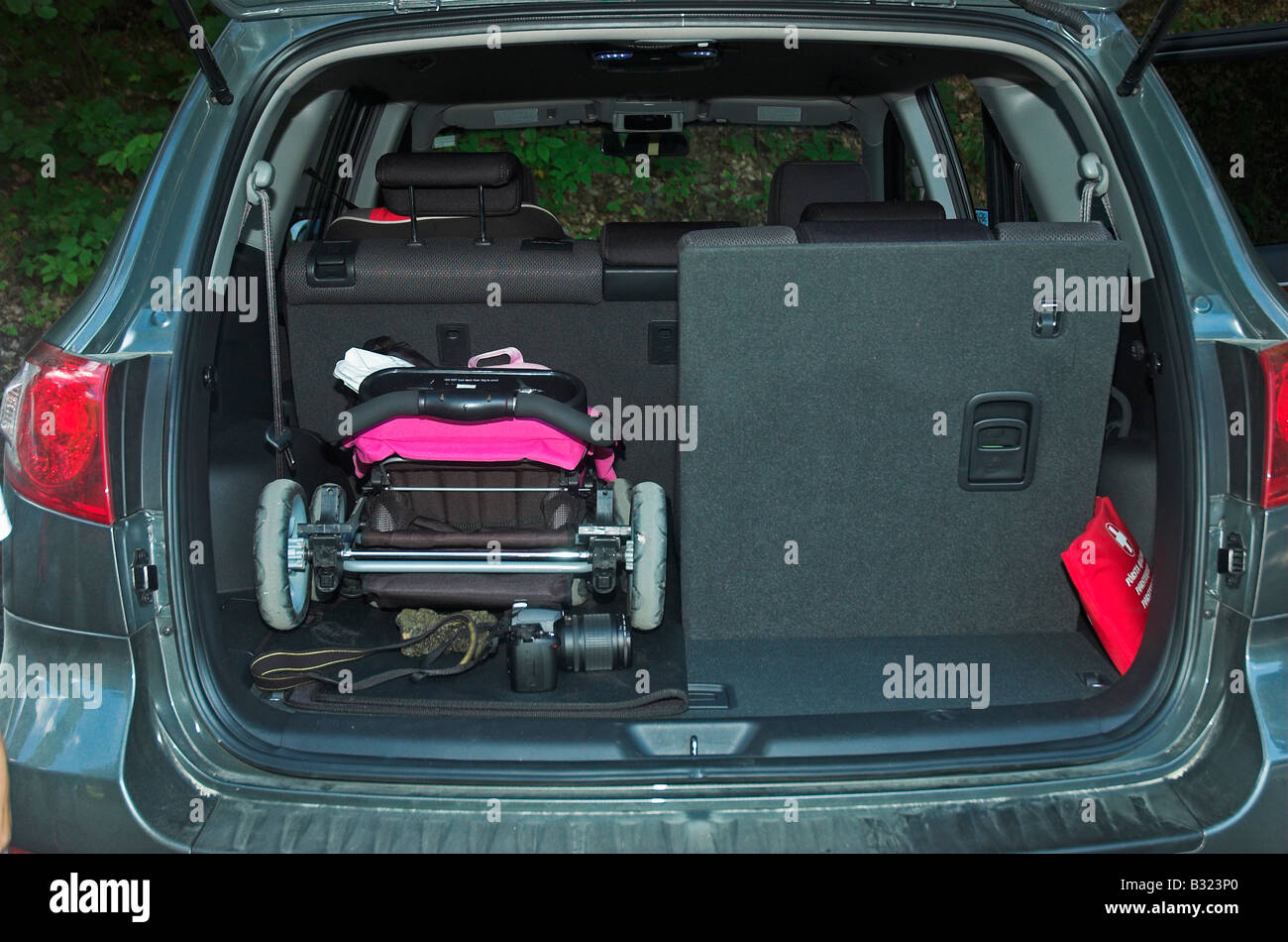 Stroller in car trunk Stock Photo - Alamy