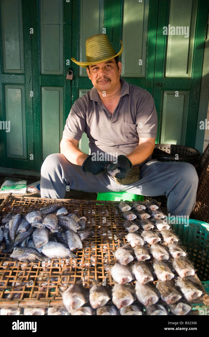 Man selling fish in a Thai Market. Bangkok Stock Photo - Alamy