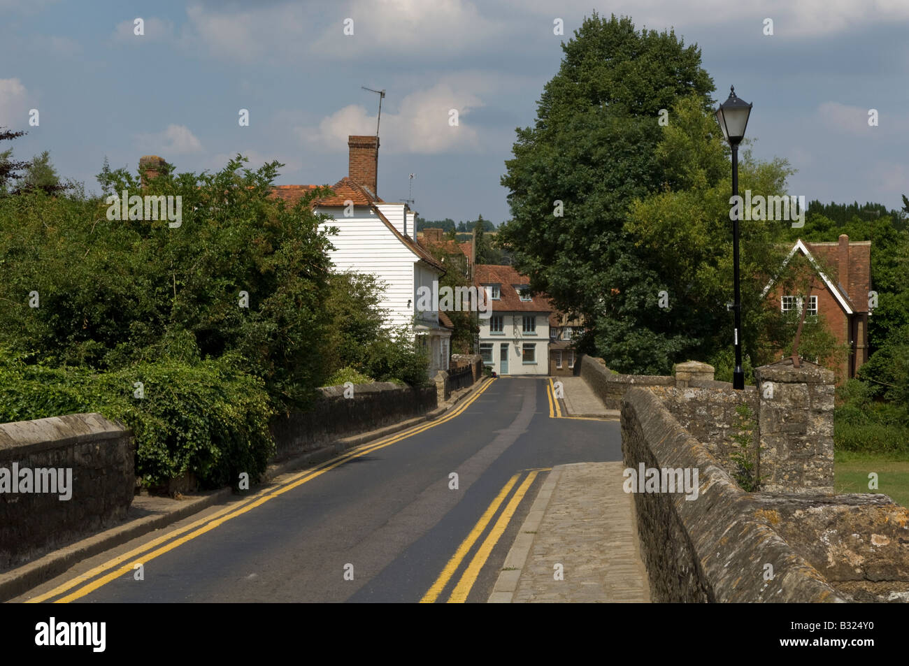 The stone bridge across the River Medway in the village of Yalding in ...