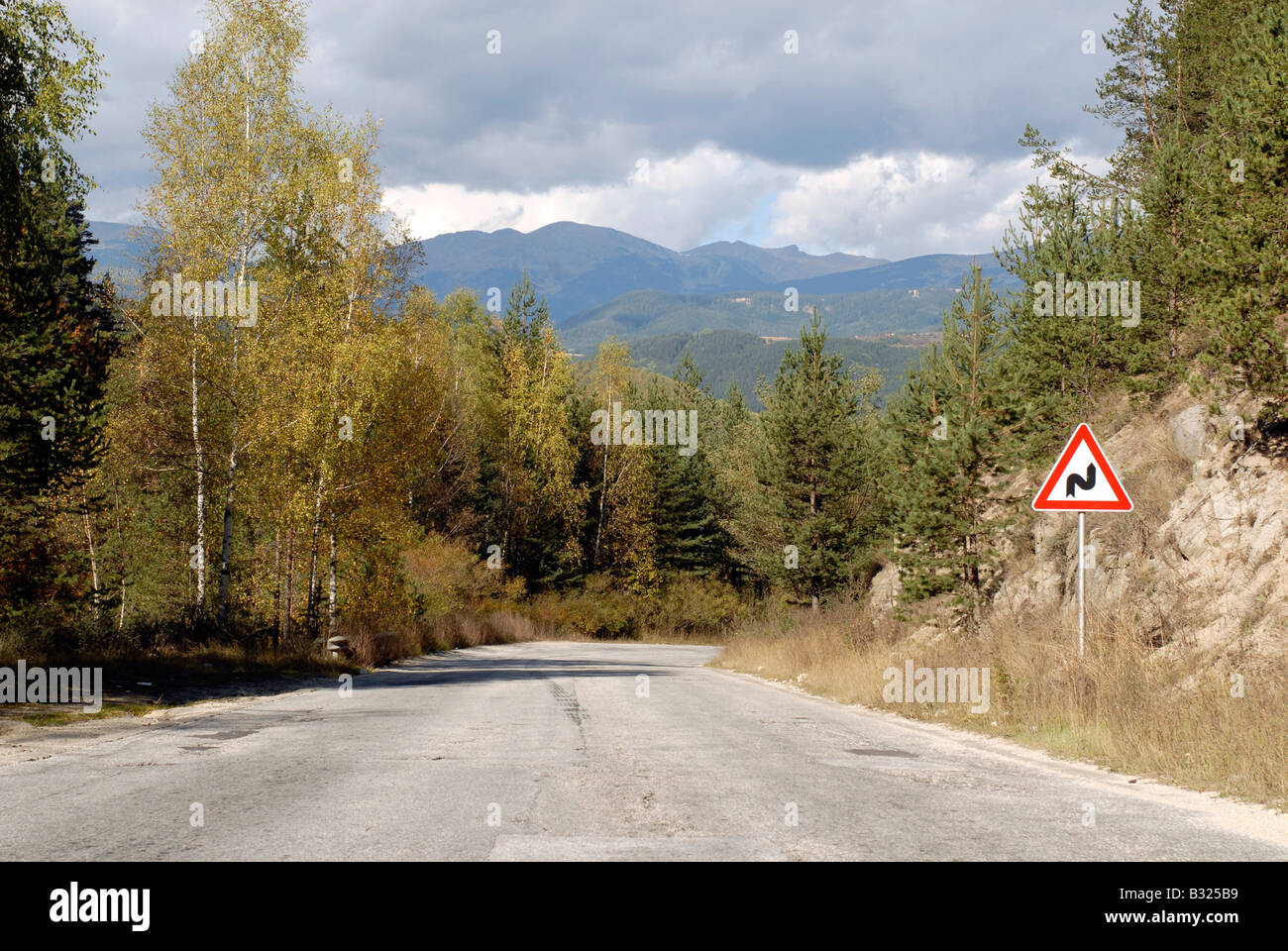 Mountain road and road sign in the Pirin Mountains, Bulgaria Stock ...
